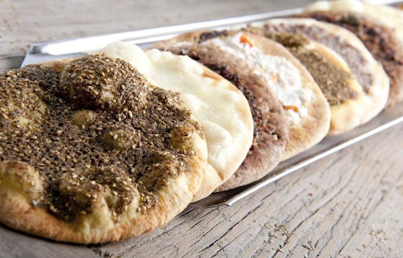 Manakish In Zaatar W Zeit | TasteAtlas | Recommended authentic restaurants