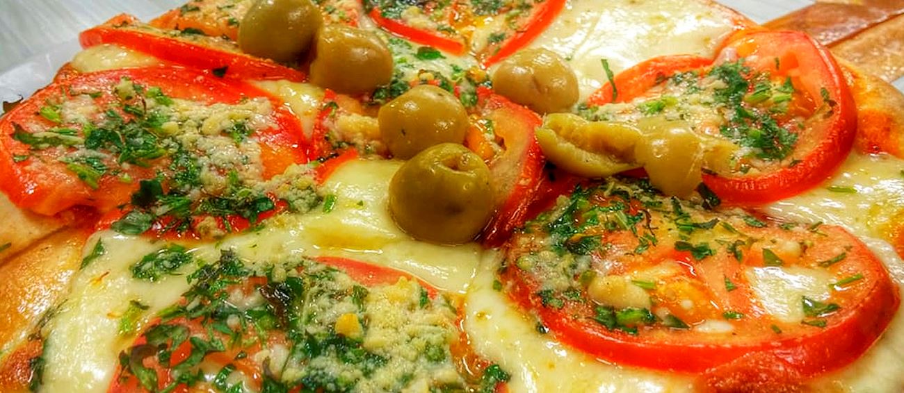 Pizza In El Cuartito | TasteAtlas | Recommended authentic restaurants