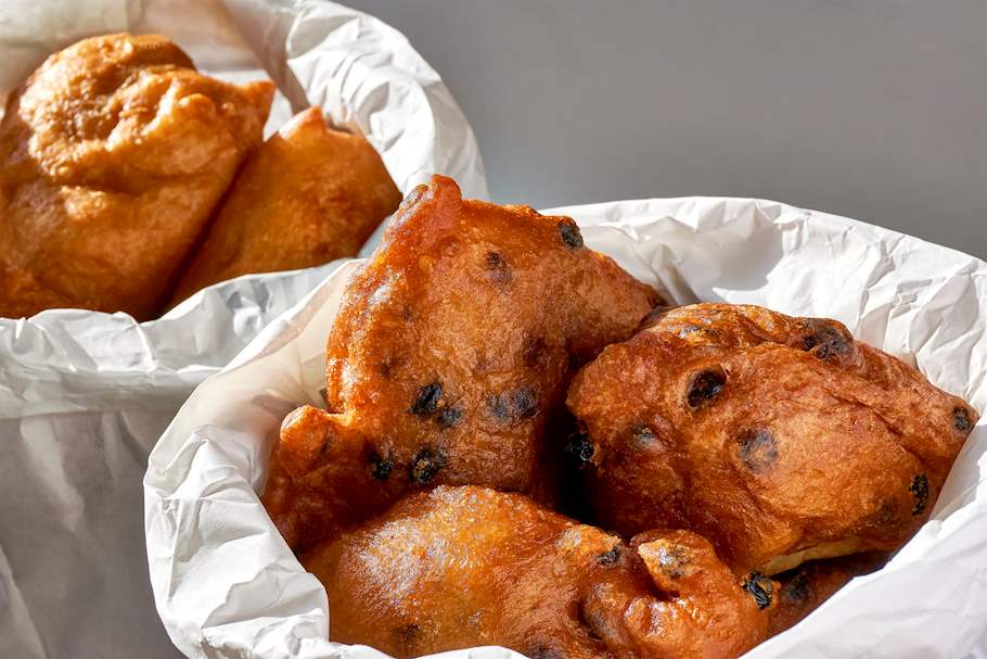 Oliebollen With Precooked Apples And Raisins Authentic Recipe | TasteAtlas